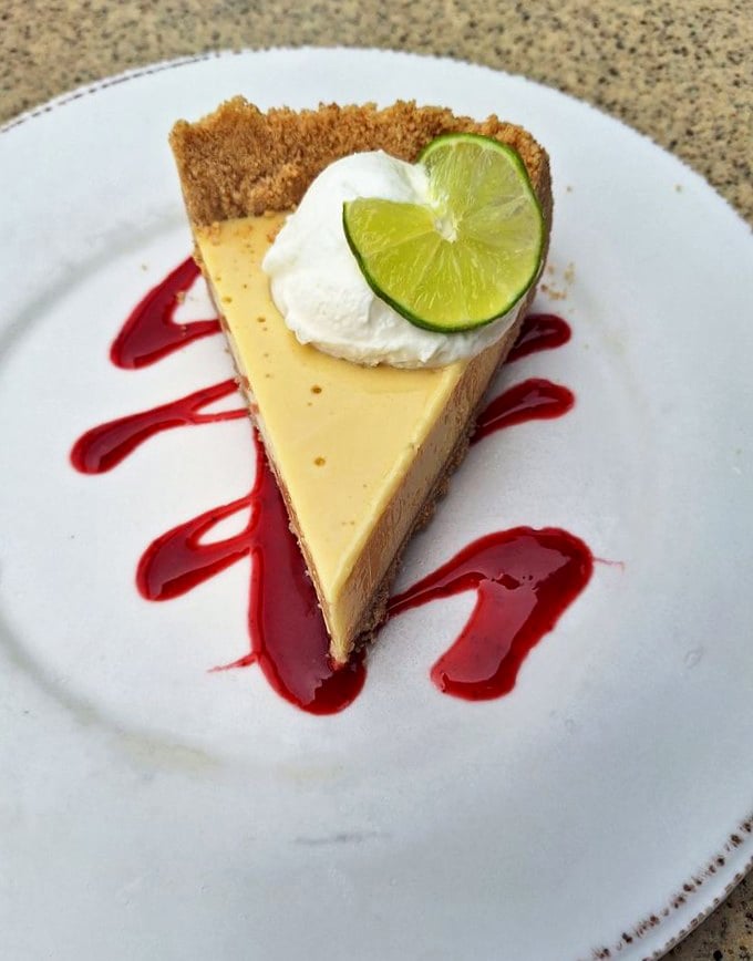Key lime pie that strikes the perfect balance between sweet and tart—like finding the ideal beach spot on a crowded summer day.