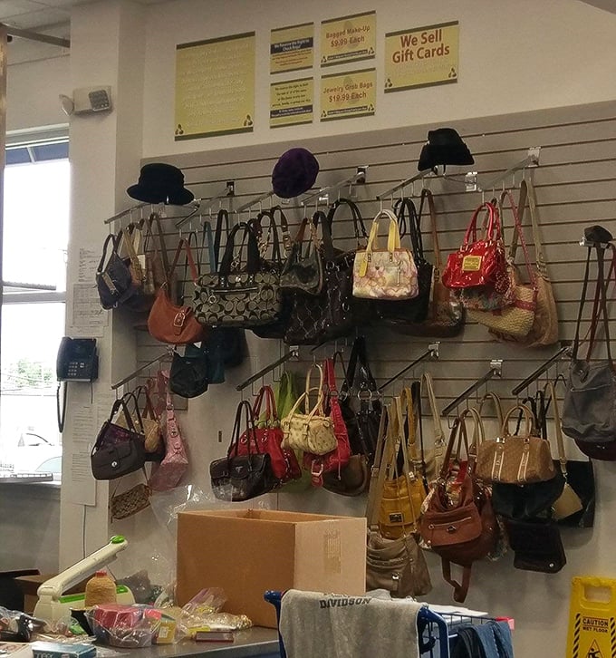 Handbag heaven! Designer purses and everyday totes hang in colorful rows, waiting to become someone's "You'll never believe where I found this!" story.