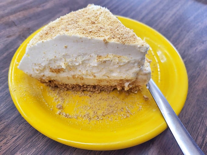 The finale you didn't know you needed—a slice of lemon pie that cuts through the richness of your meal with bright, creamy perfection.