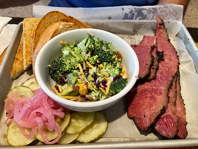 A meat platter that hits all the right notes—smoke, acid, freshness, and carbs. The broccoli salad is there to make you feel virtuous while indulging.