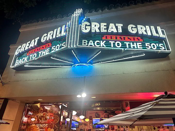 At night, the sign glows like a beacon for hungry time travelers, promising burgers, shakes, and a heavy dose of nostalgia.