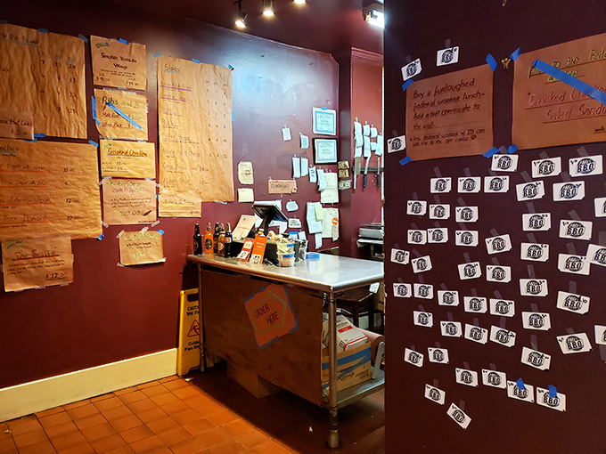Where BBQ dreams become reality—the order counter covered in notes and menus like a war room planning the next delicious offensive.