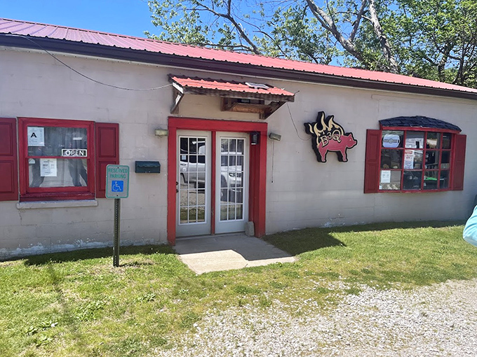 Sunshine makes everything better, including the approach to great barbecue. The red trim and flying pig welcome you to flavor town.