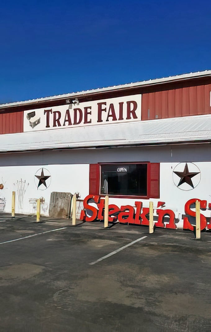 The bold red "TRADE FAIR" sign against a perfect blue Missouri sky—your beacon to bargain paradise.
