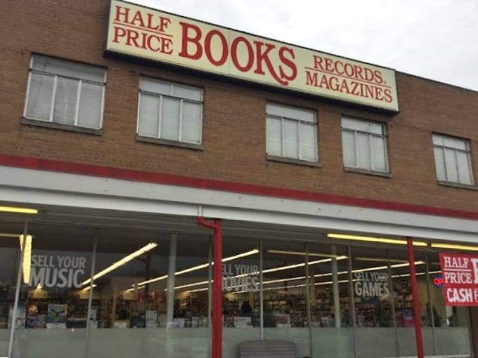The classic storefront announces its treasures plainly: Books, Records, Magazines—and the magic word that draws us all in: "Half Price."
