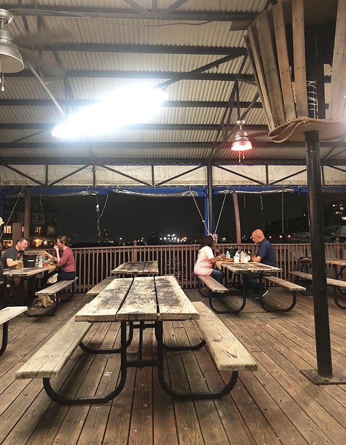 The outdoor deck offers nighttime dining under the stars—because seafood always tastes better with a side of gentle harbor breezes.