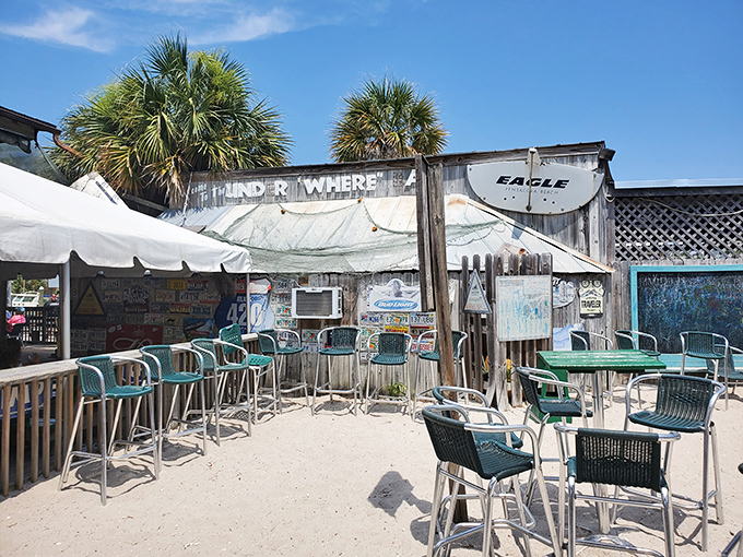Sandy floors, sea breeze, and the promise of cold drinks—this outdoor bar area isn't just casual, it's what vacation dreams are made of.