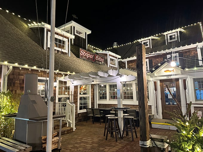 As day turns to night, the outdoor dining area transforms into a twinkling oasis—perfect for savoring seafood under the stars.