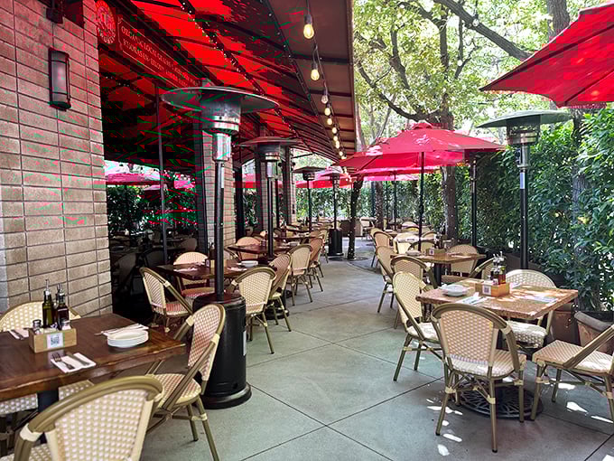 The outdoor patio, shaded by crimson umbrellas, offers al fresco dining that makes you forget you're in downtown LA and not a piazza in Florence.