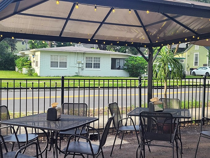 The covered patio – where Florida's sunshine is tamed just enough to let you enjoy your sandwich in perfect outdoor comfort.