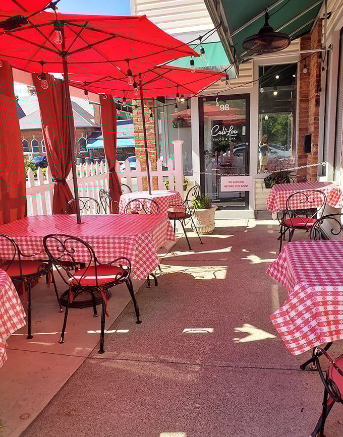 Red-checkered tablecloths under crimson umbrellas create the perfect setting for twirling pasta and gesturing wildly while telling stories.