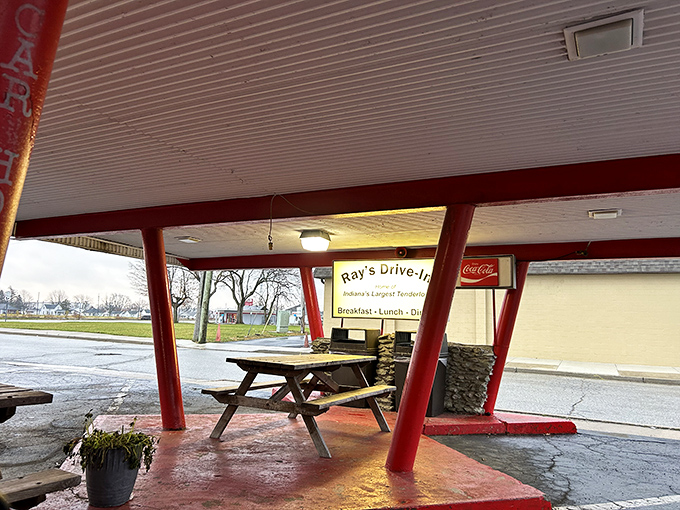 Picnic tables under the distinctive red-pillared canopy offer al fresco dining with a side of nostalgia—the perfect setting for tenderloin memories in the making.