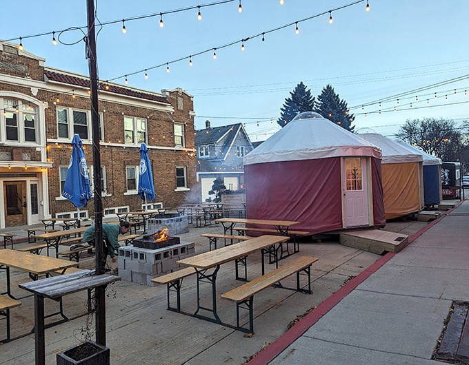 The outdoor beer garden with festive tents – because sometimes your schnitzel needs fresh air and string lights.