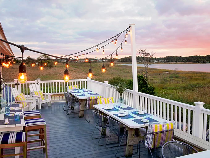 String lights and water views transform simple dining into something resembling pure coastal magic.