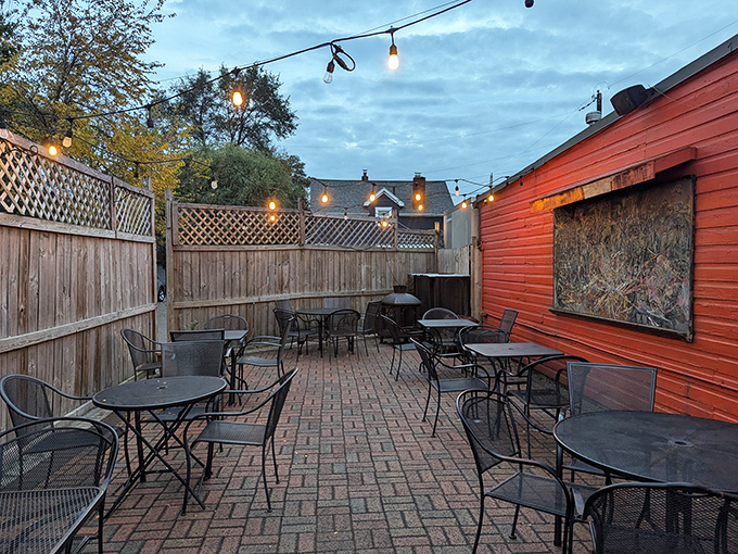 The patio where summer evenings become core memories. Those string lights aren't just illumination—they're the stars of countless happy hours and heartfelt conversations.