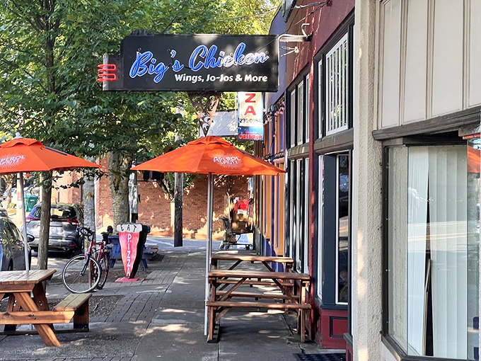 Outdoor seating that says "come for the chicken, stay for the people-watching." Those orange umbrellas are beacons of deliciousness on Portland's streets.