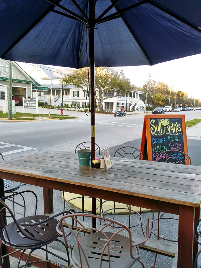 The outdoor seating area offers front-row tickets to Sullivan's Island life—where sea breezes enhance every bite and coastal living unfolds before you.