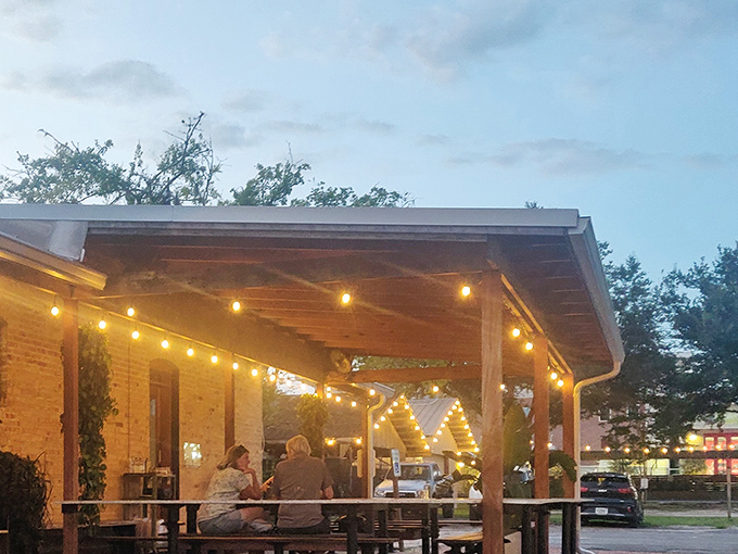 String lights and twilight create the perfect ambiance for outdoor dining. Some conversations just taste better with pizza and fresh air.