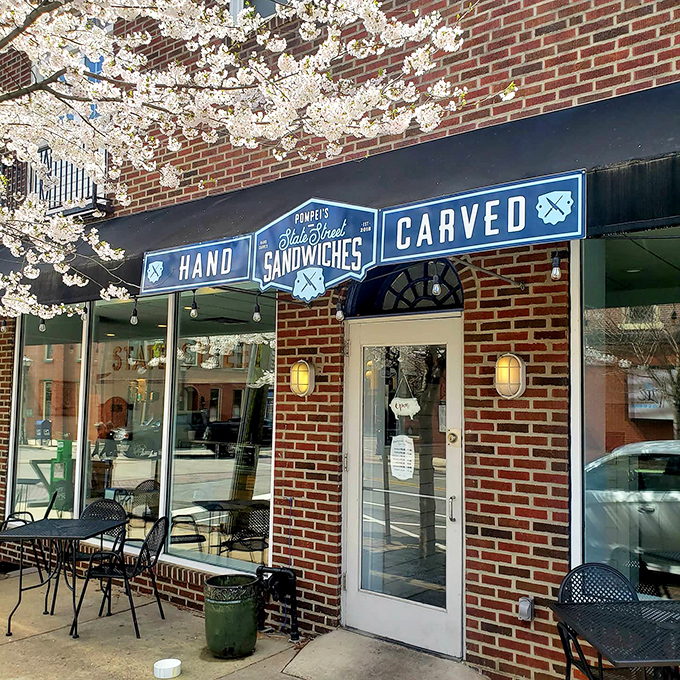 Spring blossoms frame the entrance like Mother Nature's endorsement – even she knows where to find the best sandwiches in Media.