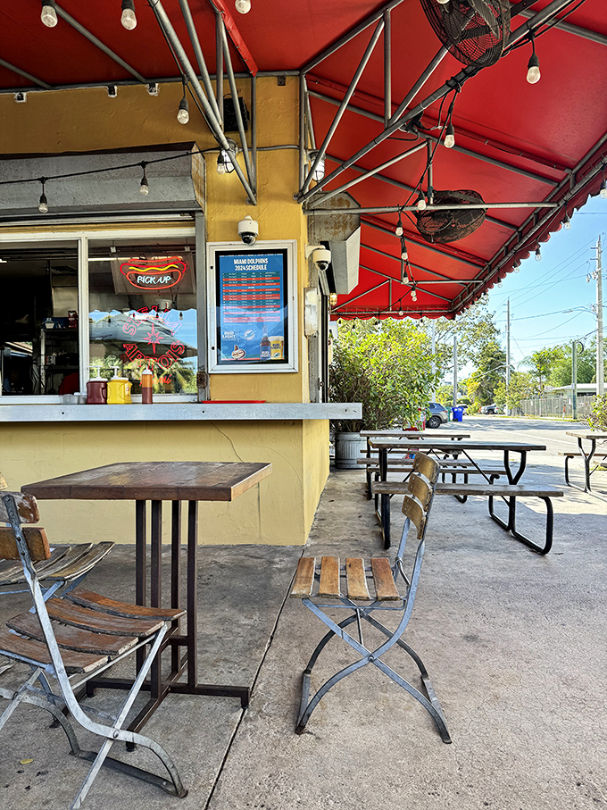 Al fresco dining, Miami style. Simple wooden tables and chairs create the perfect stage for the real star of the show—whatever delicious creation is on your tray.