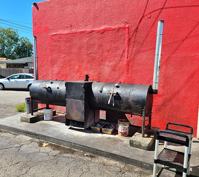 The smoker—blackened by years of service—is the true heart of any BBQ operation. This one's earned its battle scars.