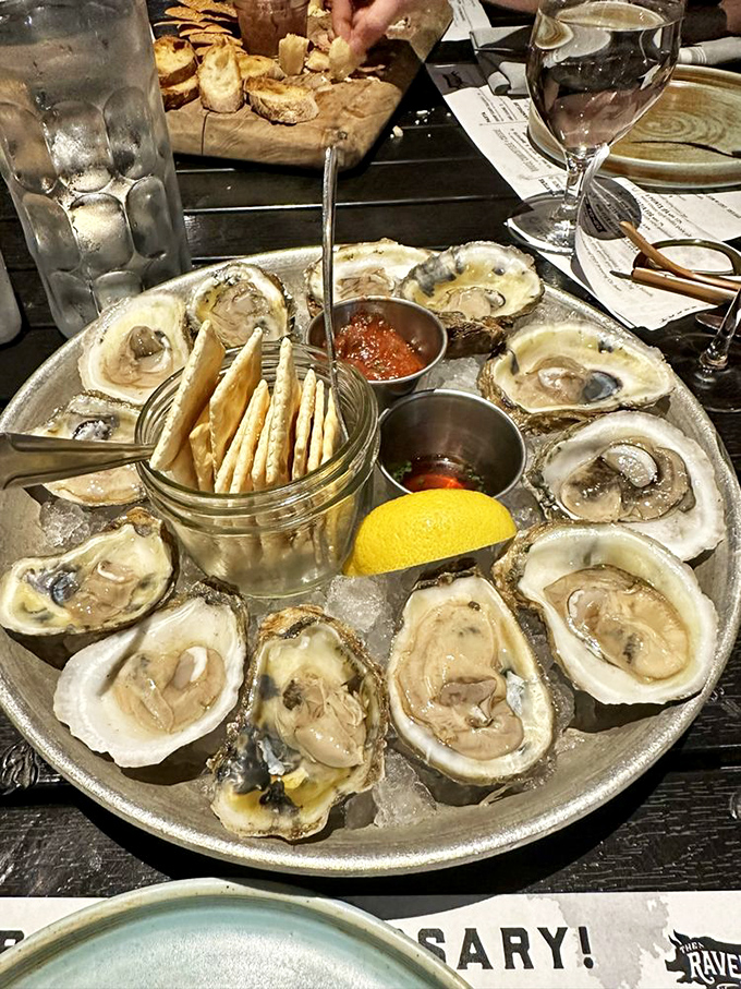 Oysters arranged like a clock counting down to seafood bliss. The mignonette sauce is the little black dress of condiments—simple, elegant, perfect.