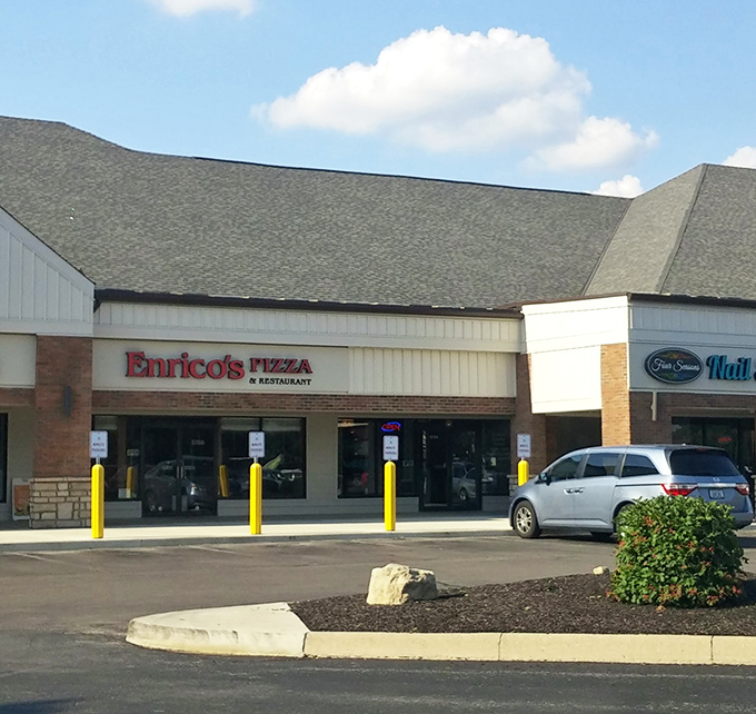 The parking lot view that signals relief to hungry travelers. That red sign means you're minutes away from forgetting all your worries.