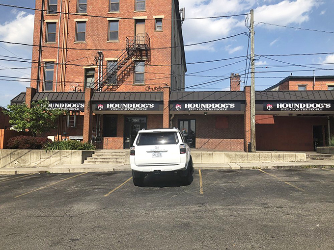 The parking lot view that has launched a thousand "I'm five minutes away" texts from people who know the pizza paradise that awaits inside.