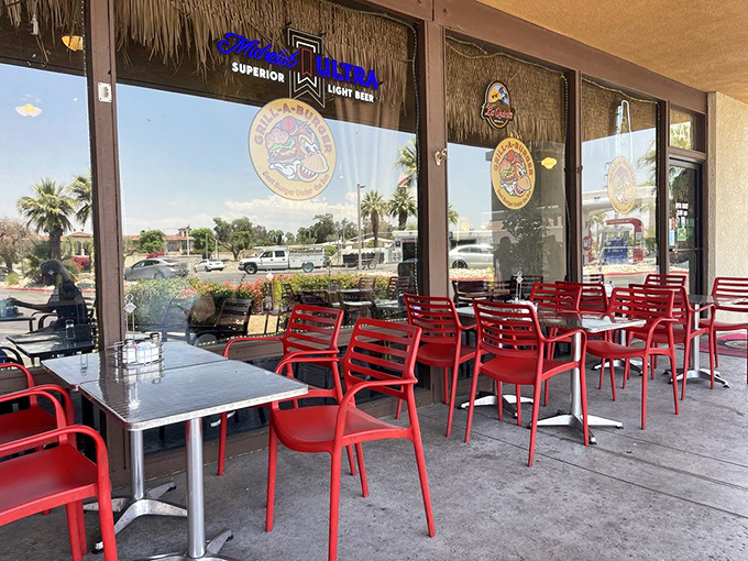 Al fresco dining, desert style. Those bright red chairs aren't just seating—they're front-row tickets to the Palm Desert people-watching show.