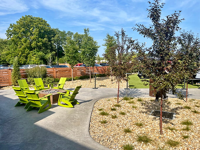 A patio designed for conversations that stretch into evening. Those lime-green chairs aren't just furniture; they're invitations to linger longer.