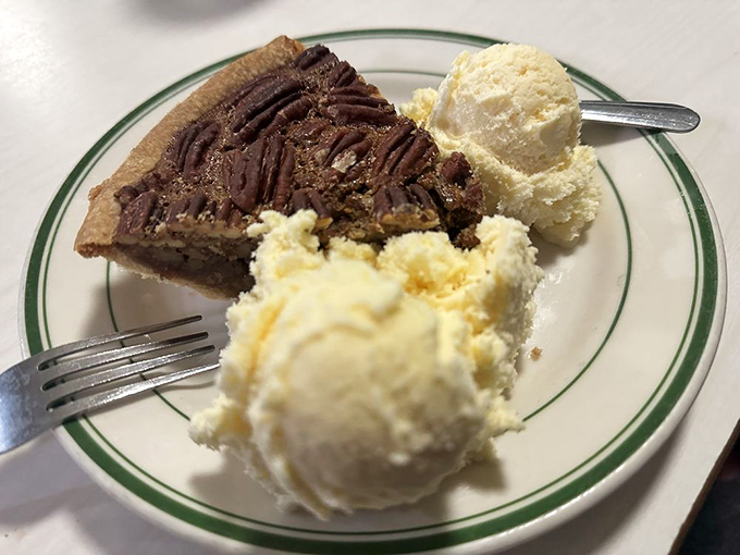 Pecan pie with ice cream—the dessert equivalent of a standing ovation. If happiness had a flavor, it would taste exactly like this.