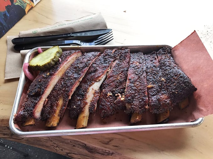 Ribs with that perfect bark and pink smoke ring—the kind that make vegetarians question their life choices, if only for a moment.