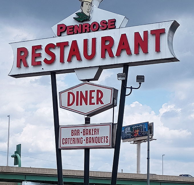 The vintage roadside sign stands tall against the Philly sky, a mid-century masterpiece promising more than just food—it's advertising happiness on a plate.