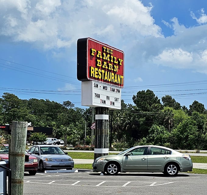 The roadside sign beckons hungry travelers like a lighthouse for the famished – promising salvation in the form of home-cooked meals.