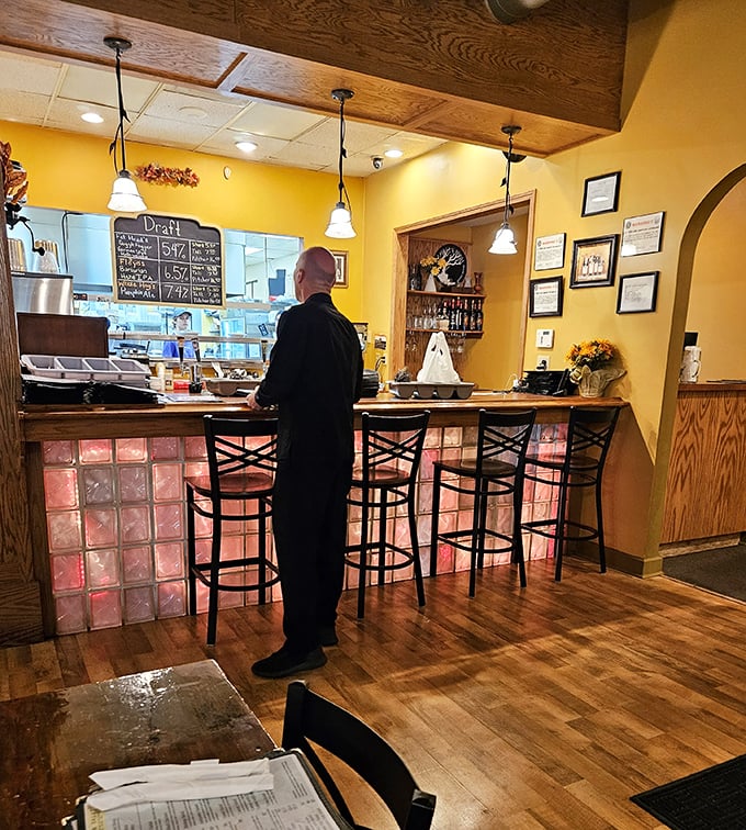 The bar area—where strangers become friends and friends become family, all united by the universal language of good food and drink.