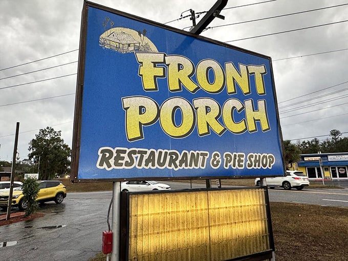 The sign stands like a beacon of hope for hungry travelers. "Front Porch Restaurant & Pie Shop"—eight words that promise happiness.