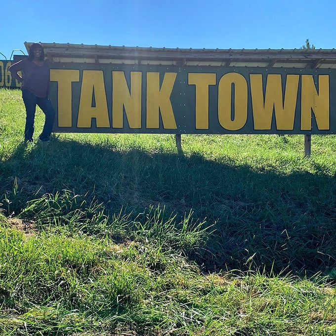 The entrance sign promises exactly what it delivers – a town of tanks. No false advertising here, just 60 tons of tracked adventure waiting beyond.