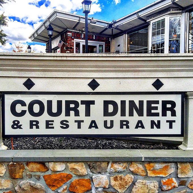 That sign isn't just announcing a restaurant—it's signaling a landmark. Court Diner's stone and brick foundation is as solid as its reputation.