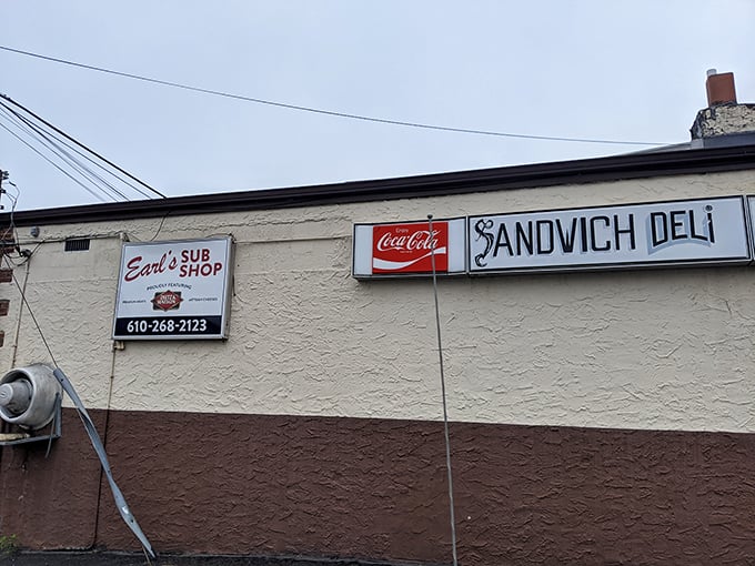 The side signage – announcing "Earl's Sub Shop" and "Sandwich Deli" with no pretense, just the straightforward promise of good eating ahead.
