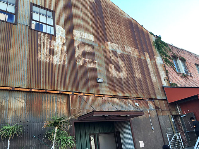 The weathered metal exterior proudly wears the Bestia name like a badge of honor—a culinary fortress in LA's concrete jungle.