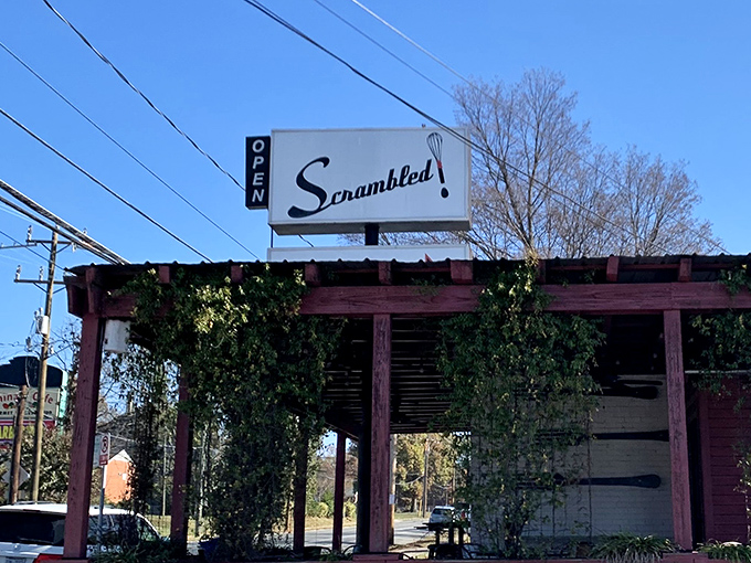 The Scrambled sign stands tall against Carolina blue skies, a beacon calling hungry travelers to the promised land of perfect eggs.