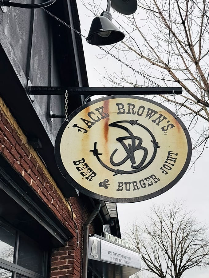 That weathered sign swinging gently above the sidewalk—a beacon for those seeking honest food in an increasingly complicated world.