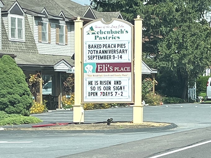 The roadside sign announces "70th Anniversary" and operating hours—a landmark that's been measuring life in pastries for generations.