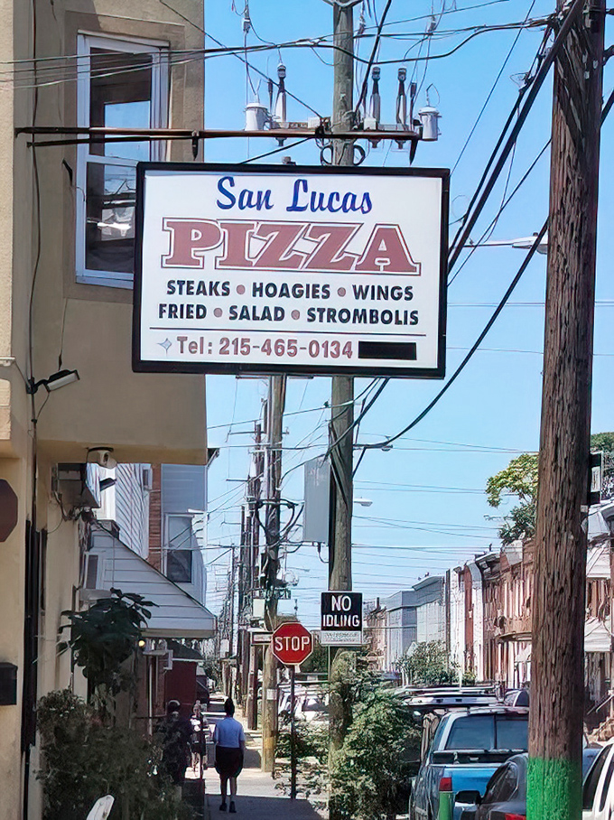 The sign that's guided hungry Philadelphians to pizza paradise for years. Like a lighthouse for those lost in a sea of mediocre food options.