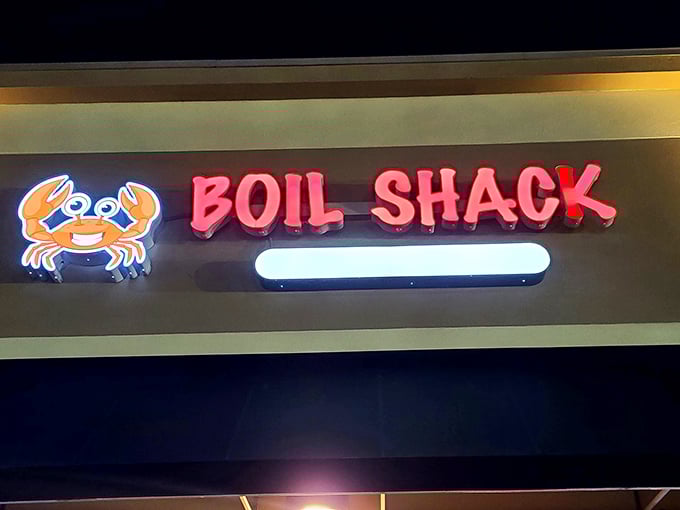 The neon sign glows like a lighthouse beacon for hungry sailors—that smiling crab knows exactly what treasures await inside.