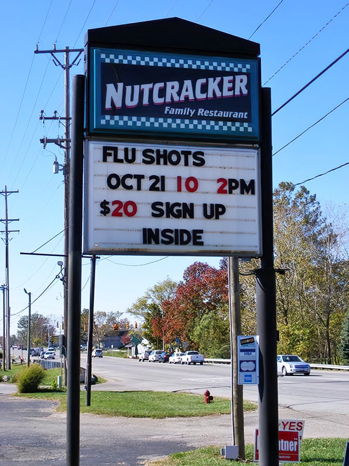 The roadside sign that does double duty—advertising both comfort food and flu shots. Only in a true community gathering place!