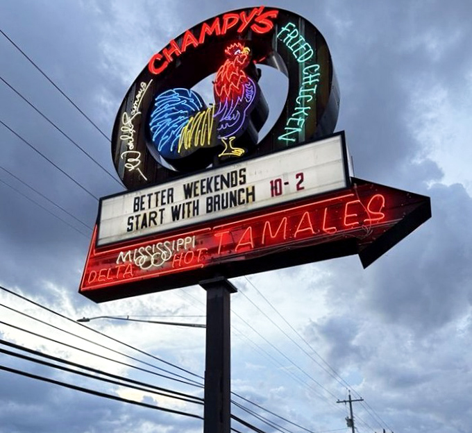 That neon rooster sign doesn't just advertise chicken—it's a beacon of hope for the hungry and a promise of Mississippi Delta flavors in Tennessee.