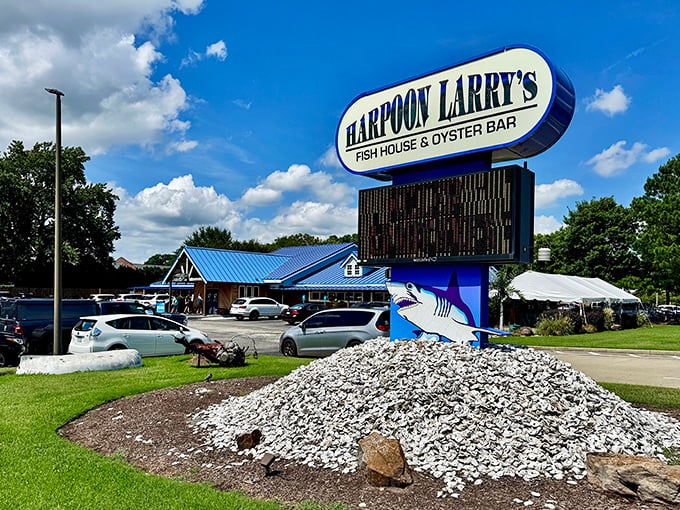 That mountain of oyster shells beneath the sign isn't decoration—it's a monument to countless delicious memories made at Harpoon Larry's.