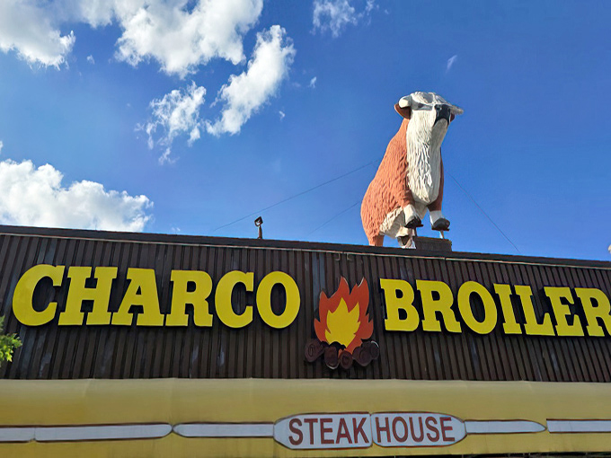 That cow silhouette isn't just a mascot – it's practically the mayor of this corner of Dallas, overseeing countless memorable meals.