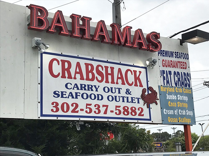 This sign isn't just advertising—it's a lighthouse for hungry travelers. "Premium Seafood Guaranteed" isn't just a slogan; it's a solemn promise to your taste buds.